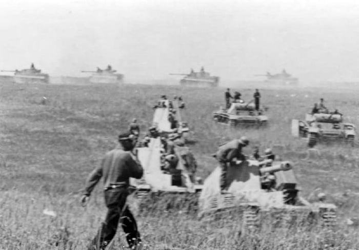 German mechanized unit rolls through the Russian plane. Four Tiger I’s ...