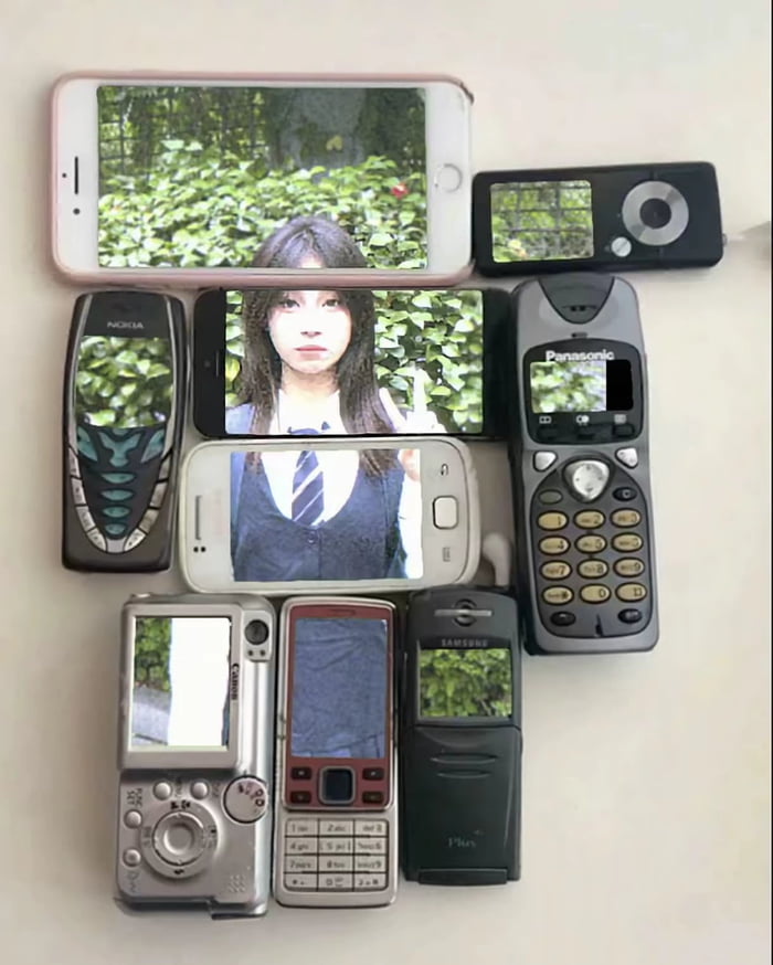 A creative display of vintage and modern phones, each showing a piece of a larger image. It's a ...