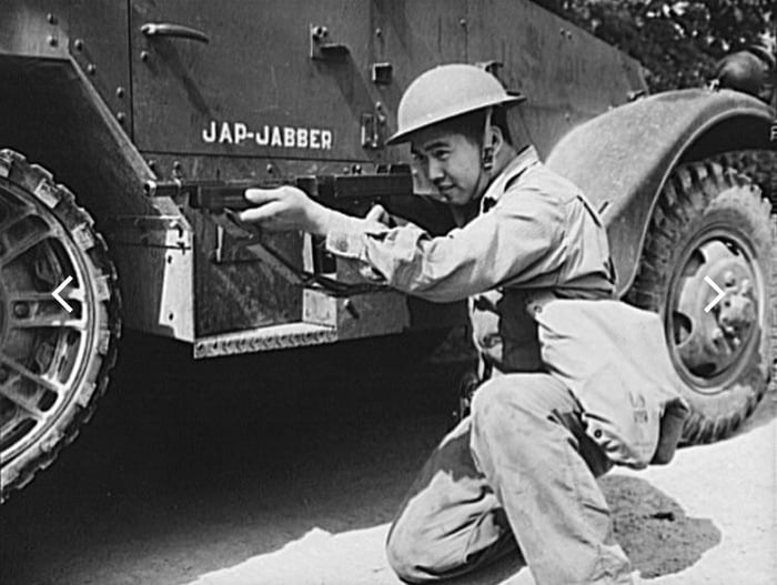 A Chinese-American member of a Half-Track crew photographed training at ...
