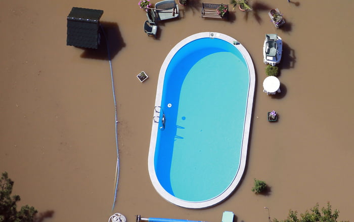A pool during a flood that just barely doesn't contaminate the pool - 9GAG