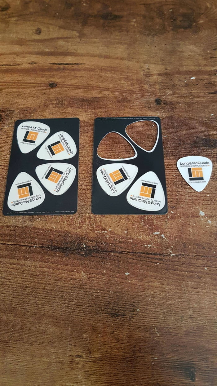 This music stores business cards are guitar pics - 9GAG