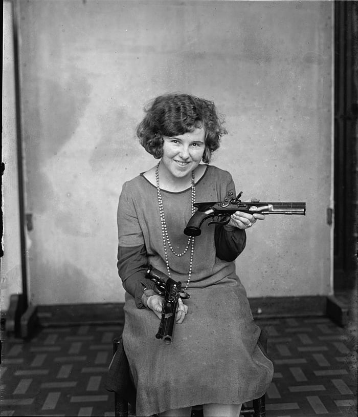 An Employee for the National Museum holding two dueling pistols owned ...