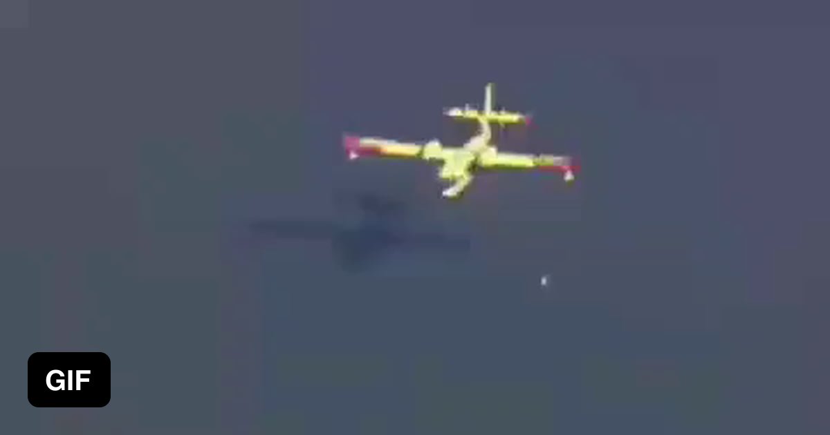 Firefighting plane swooping down to pick up water from a lake. - 9GAG