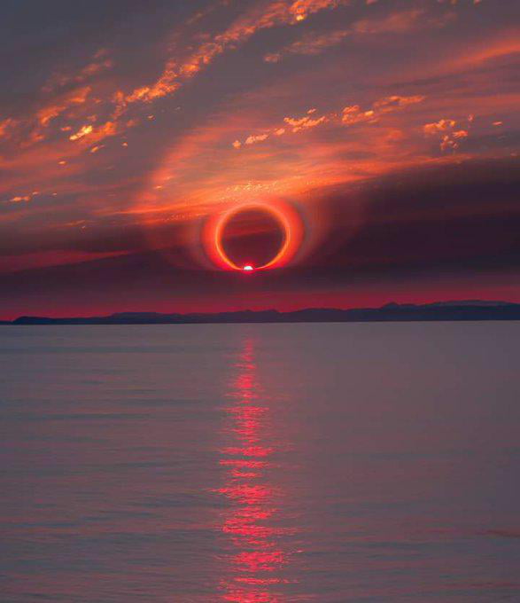Extremely rare solar halo captured during sunrise. - 9GAG