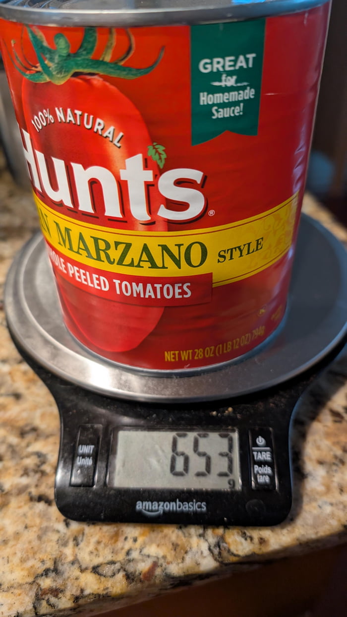 This unopened, intact can of tomatoes weighs approximately 18% less ...