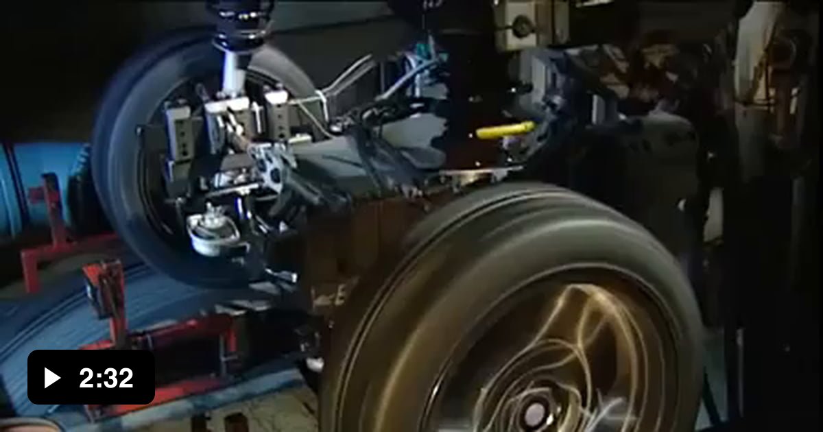 The chassis of a 1998 BMW M5 being stress tested on a specialized test ...