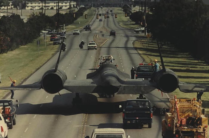 A good size visual of the SR-71 Blackbird while being moved in Michigan 2003. (56ft wingspan) - 9GAG