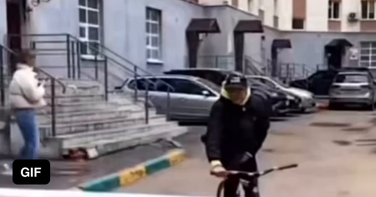 Man rides bicycle under gate - 9GAG