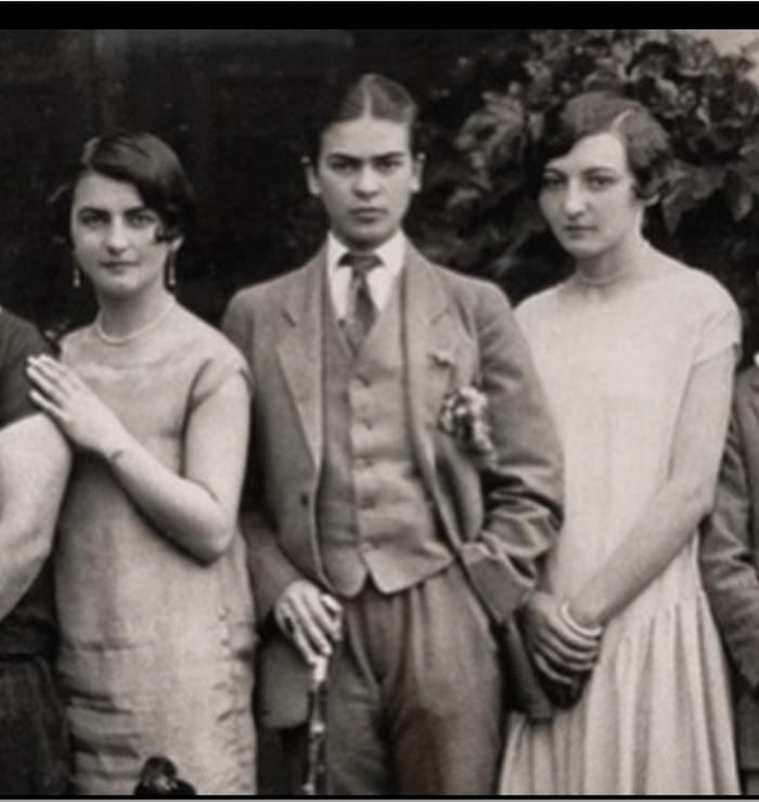 Frida Kahlo in a family photo, wearing a 3-piece suit and holding a ...