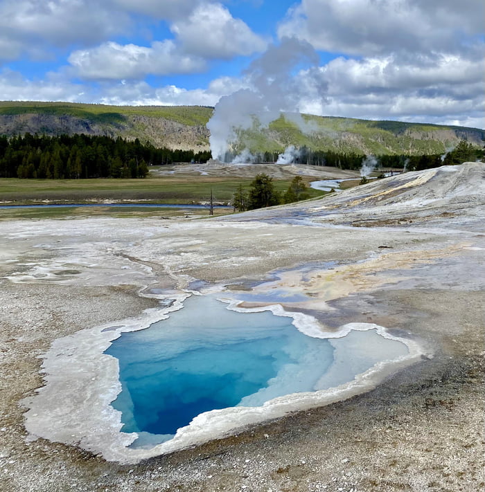 This glass-like surface of this hot spring in Yellowstone National Park - 9GAG