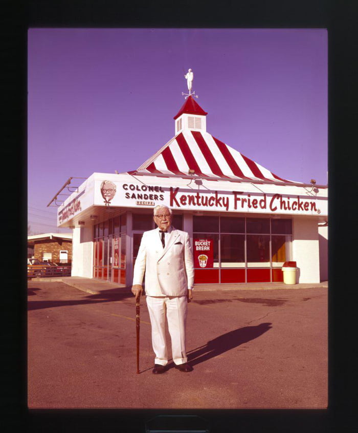 Colonel Harland Sanders, standing in front of the first KFC (1952) - 9GAG