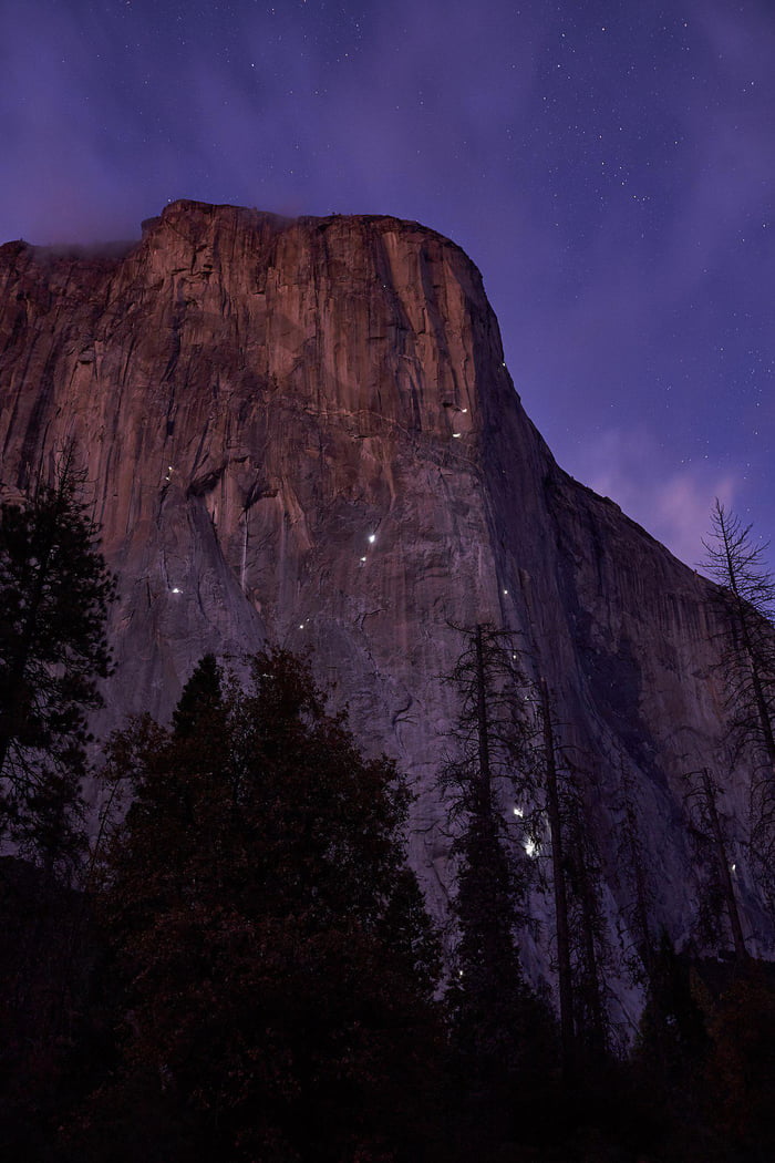Climbers at night on the sheer granite face of El Capitan in Yosemite ...