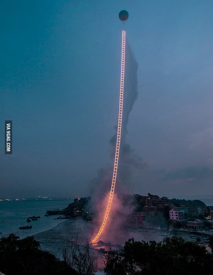 Artist creates a 500-meter ladder of fire in the sky - 9GAG