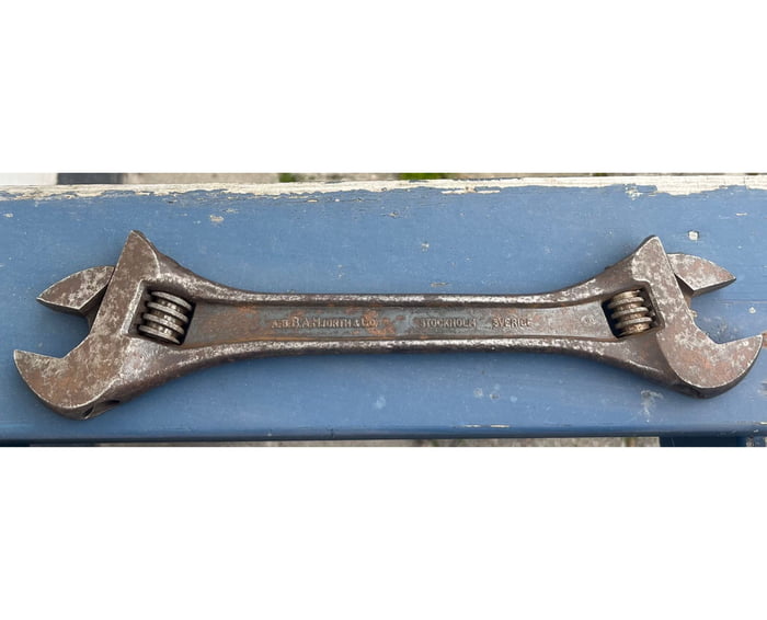 My dad shows his wrench, it's double-ended with metric on one side and ...