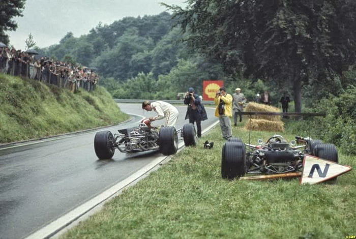 Graham Hill had abandoned the race - lends his visor to teammate Jo ...