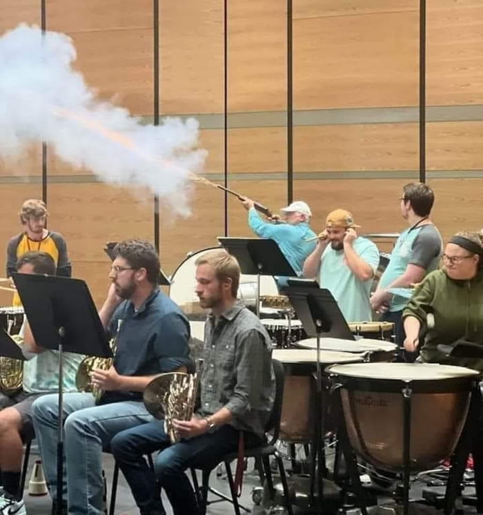 This band has someone playing a "Gun" as a percussion instrument - 9GAG