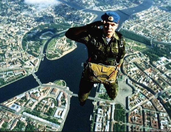 Soviet paratrooper jumping over St. Petersburg (then Leningrad). Date ...