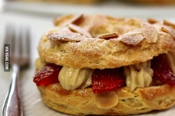 A choux pastry ring with praline cream and strawberries. - 9GAG
