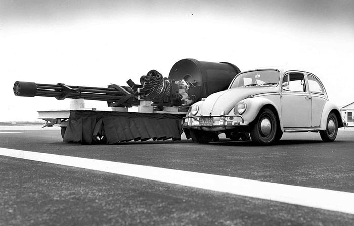 The GAU-8/A Avenger 30 mm cannon besides a Volkswagen beetle. The ...