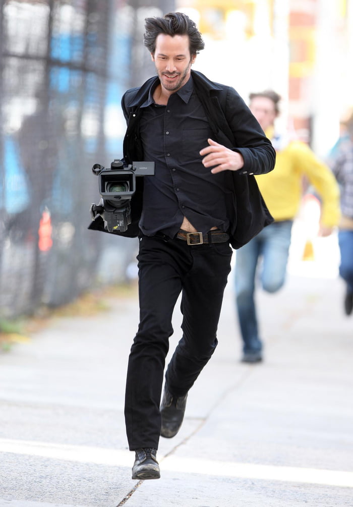 Keanu Reeves Running from a Paparazzi Because He Stole His Camera is by ...