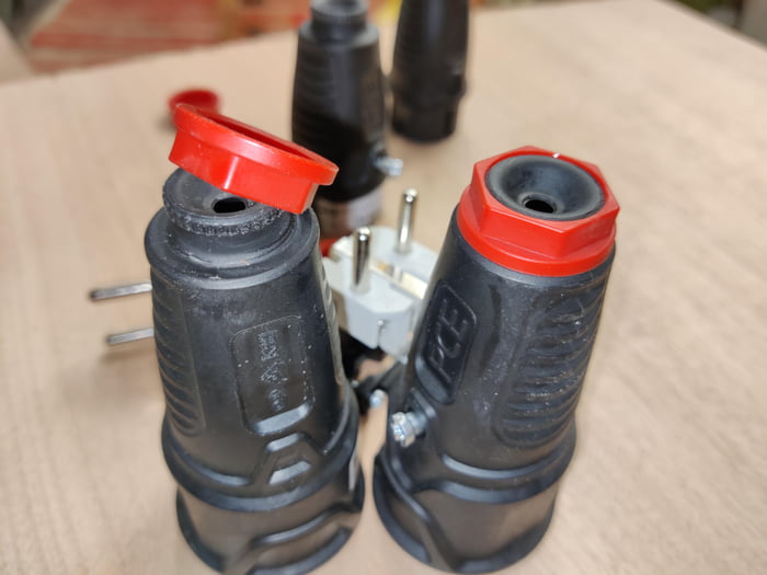 Extension cord socket/plug-end made to look like a cable gland but has ...